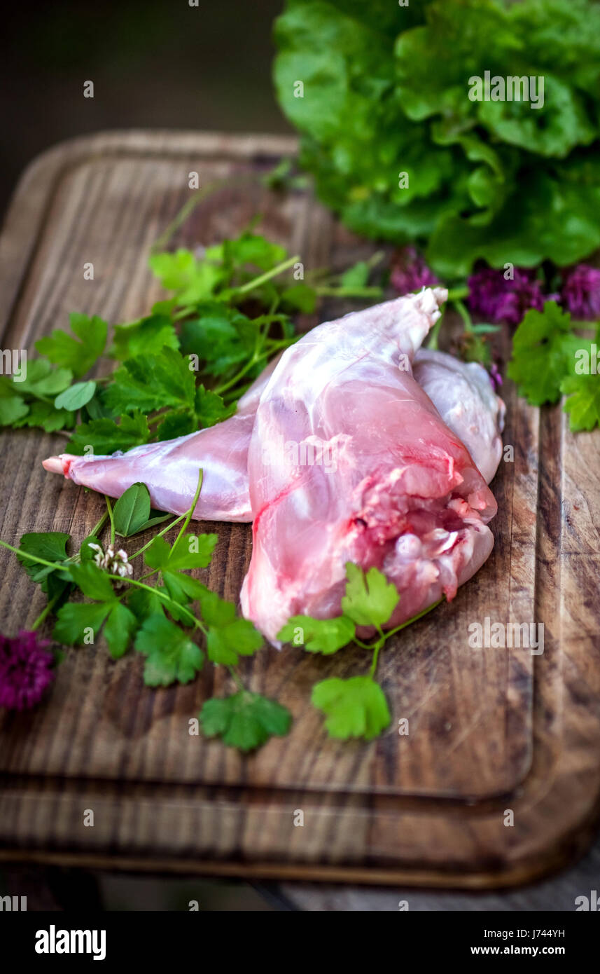 Raw fresh rabbit meat on wooden background Stock Photo - Alamy