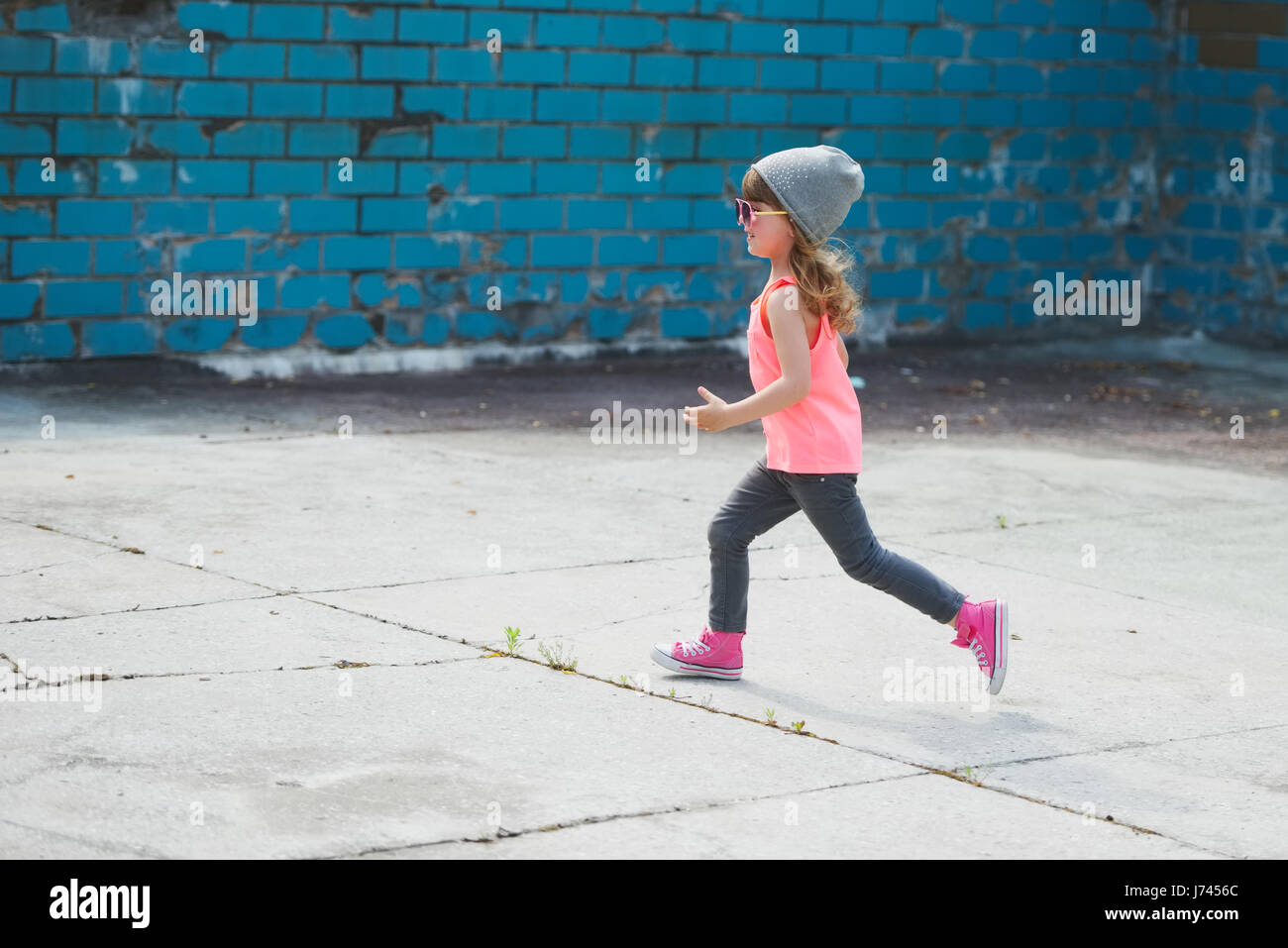 cute little hipster girl running away Stock Photo - Alamy