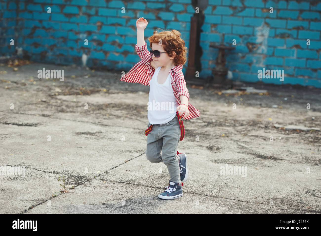 cute little hipster boy running away Stock Photo - Alamy