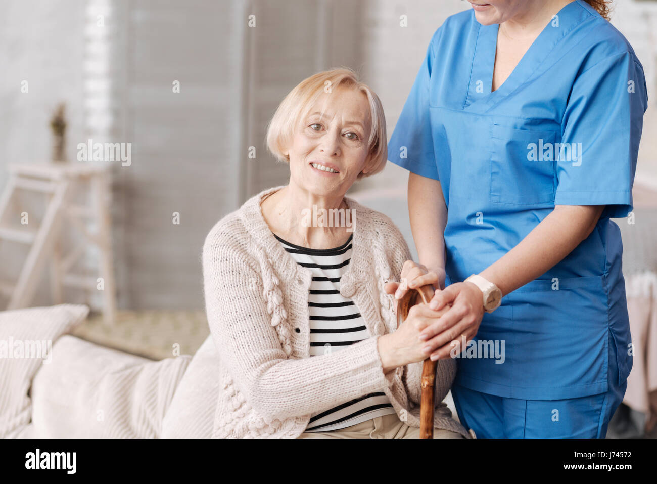 Private doctor taking care of elderly patient Stock Photo - Alamy