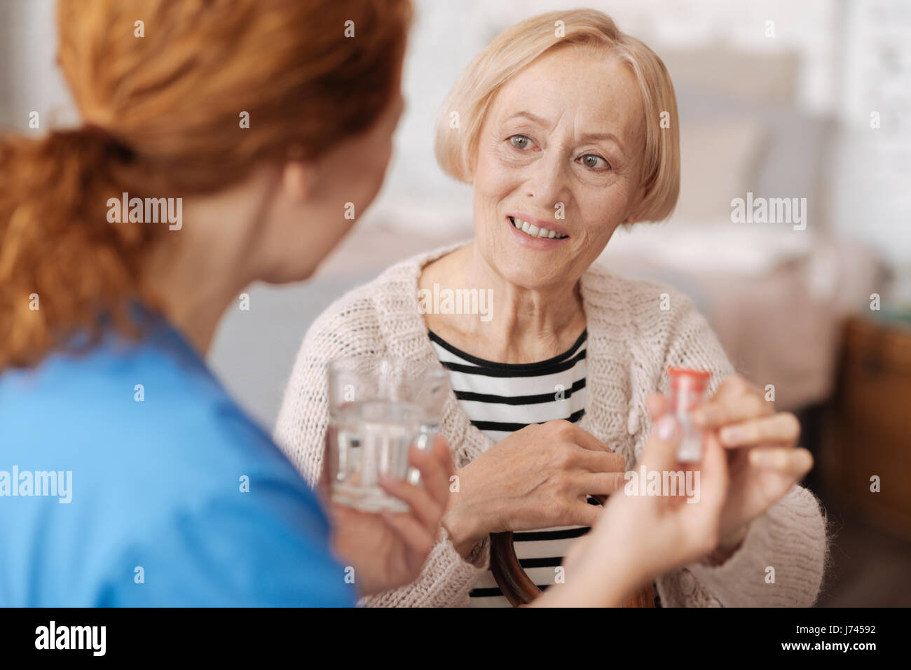 Lovely elderly woman receiving medical assistance Stock Photo - Alamy