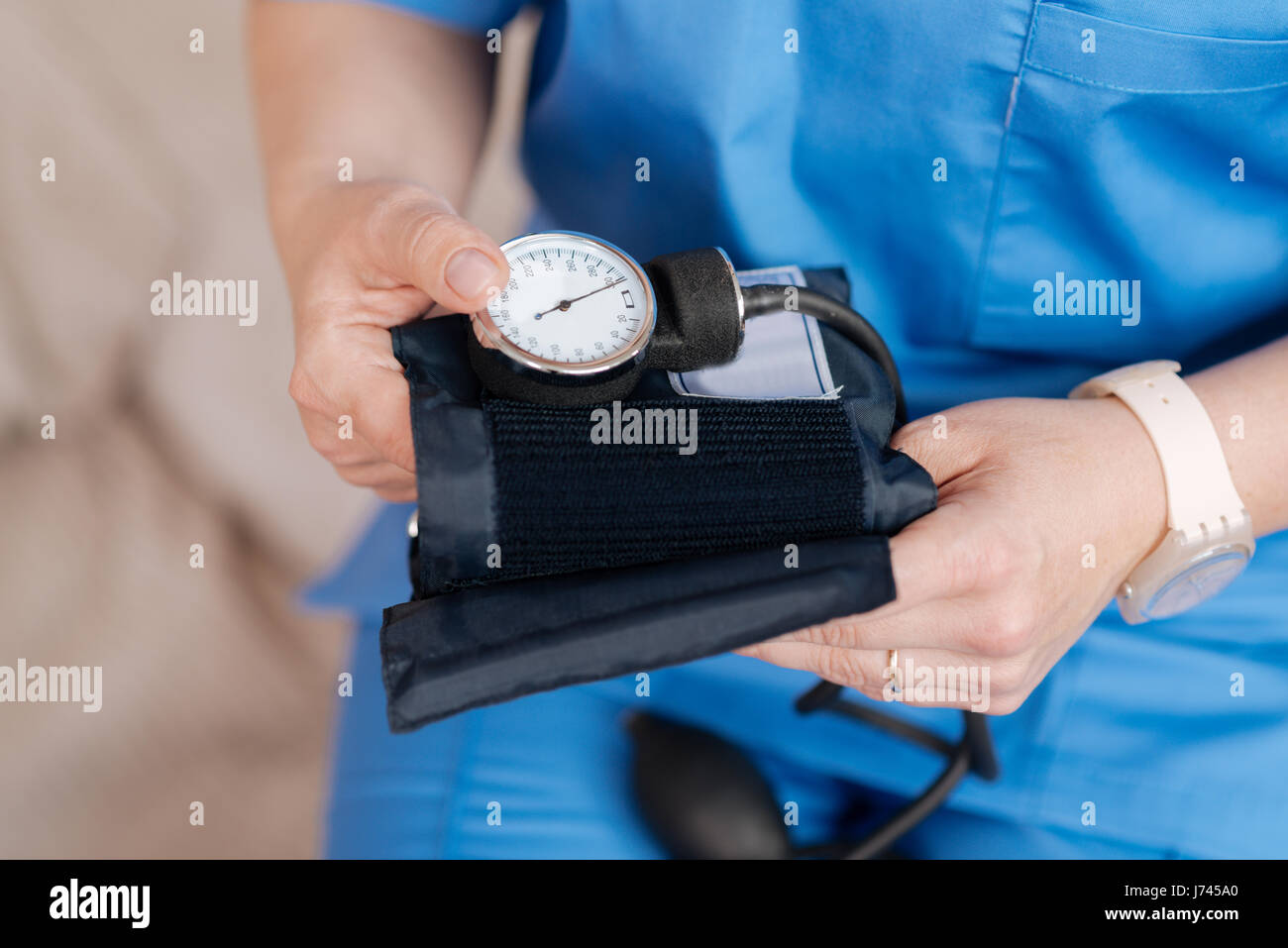 Skillful prominent medical worker holding a tonometer Stock Photo - Alamy