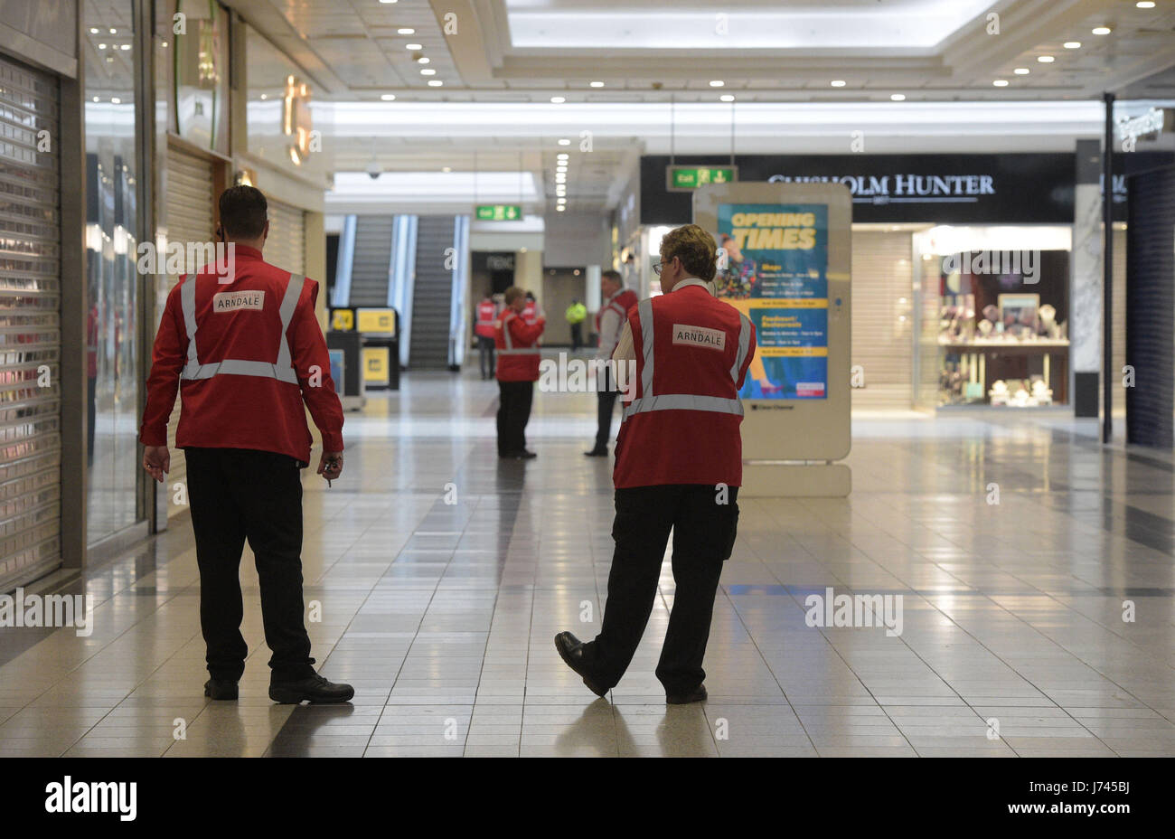 Security staff inside the Arndale Shopping Centre in Manchester city ...