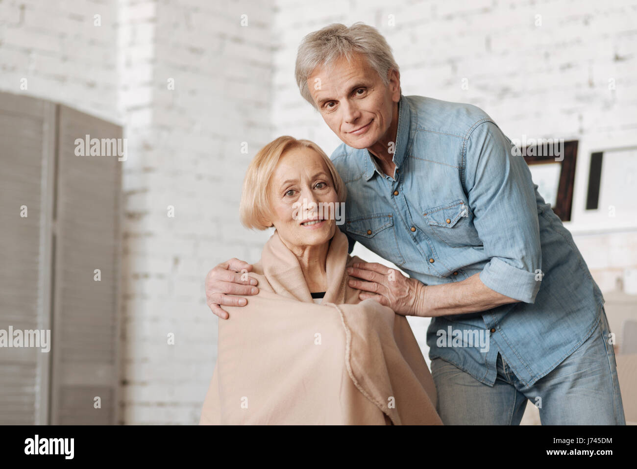 Romantic loving gentleman bringing his wife a blanket Stock Photo - Alamy