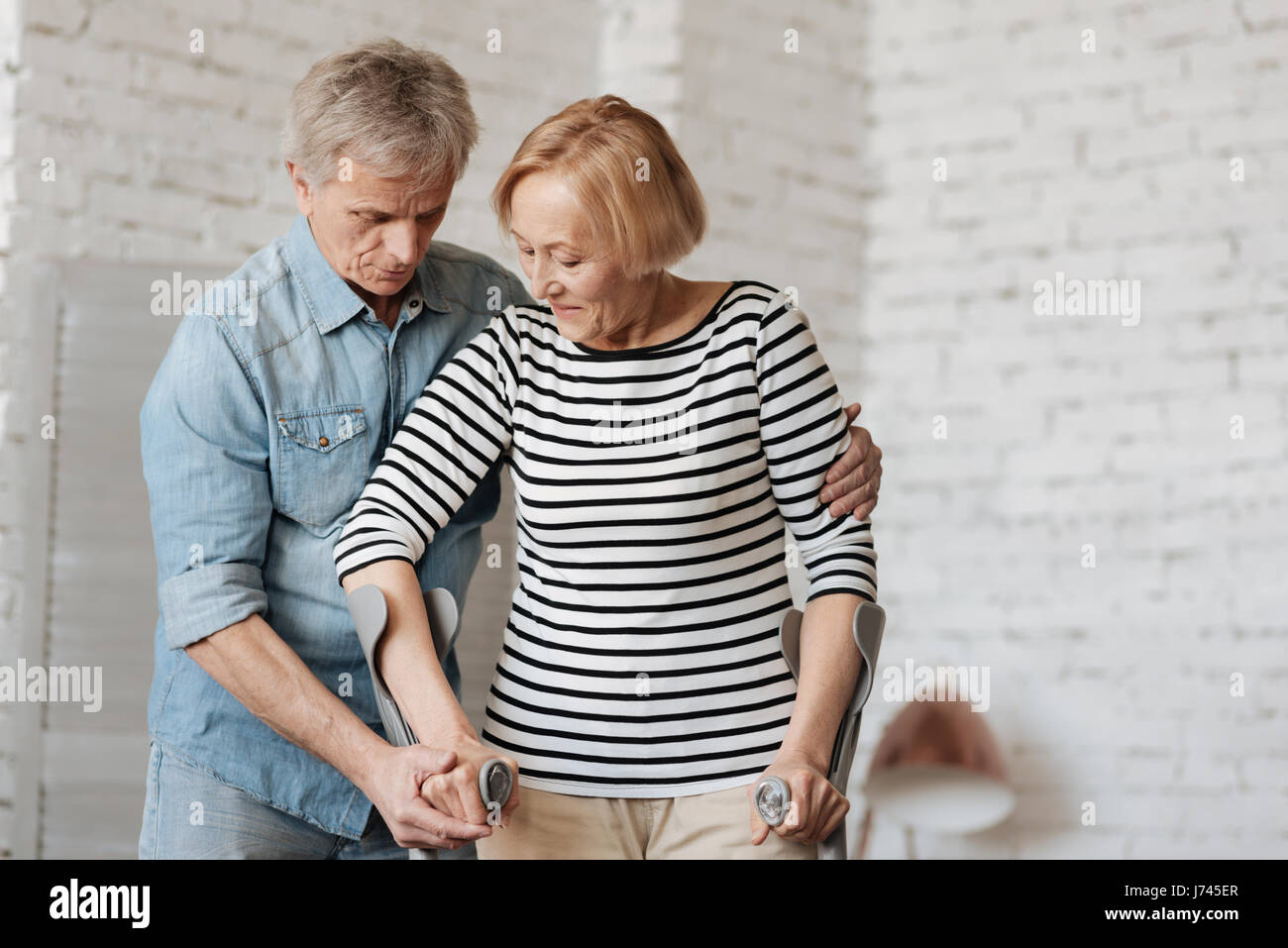 Committed lively woman learning how to walk again Stock Photo - Alamy