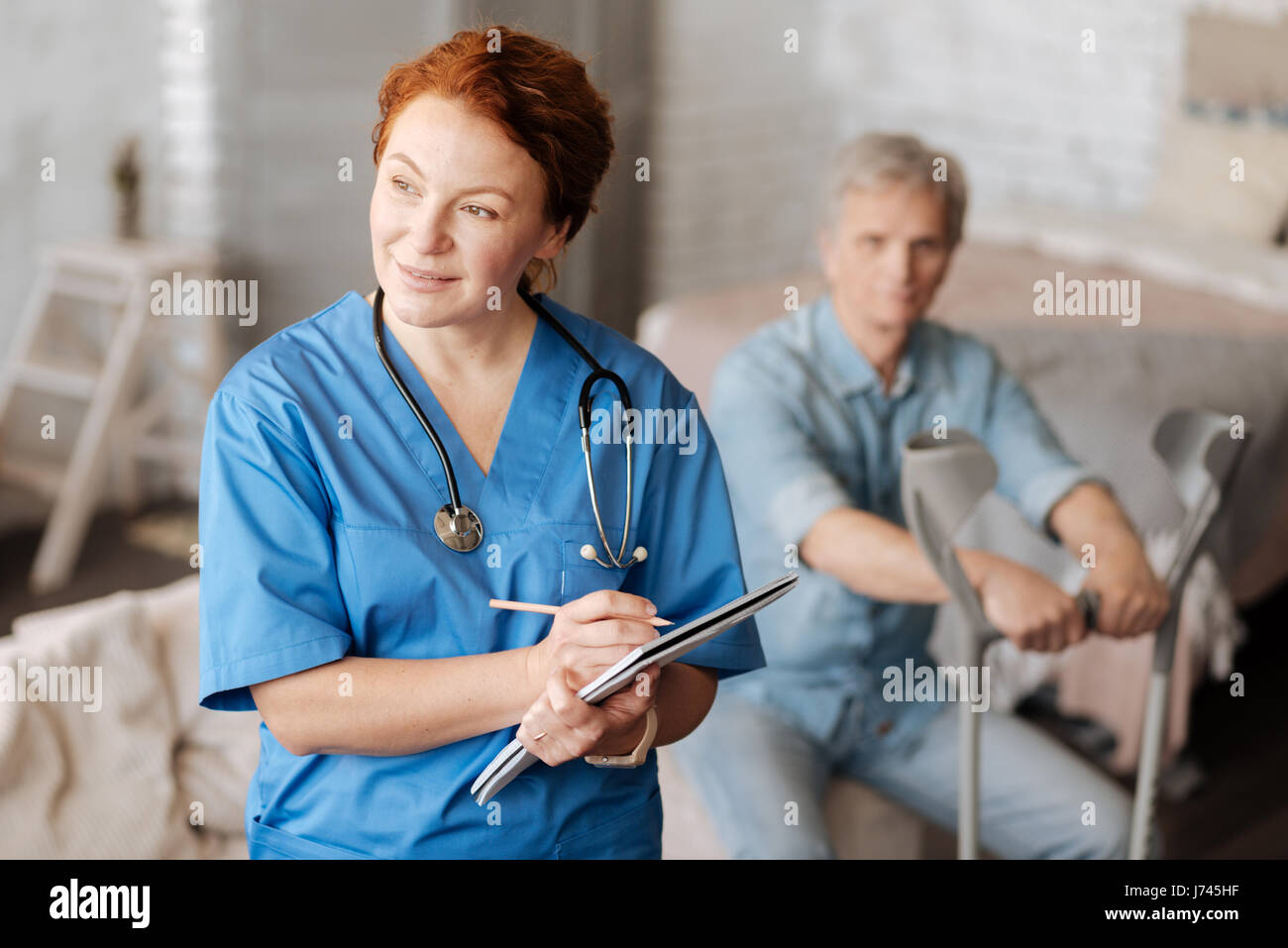 Focused prominent doctor thinking about diagnosis Stock Photo - Alamy