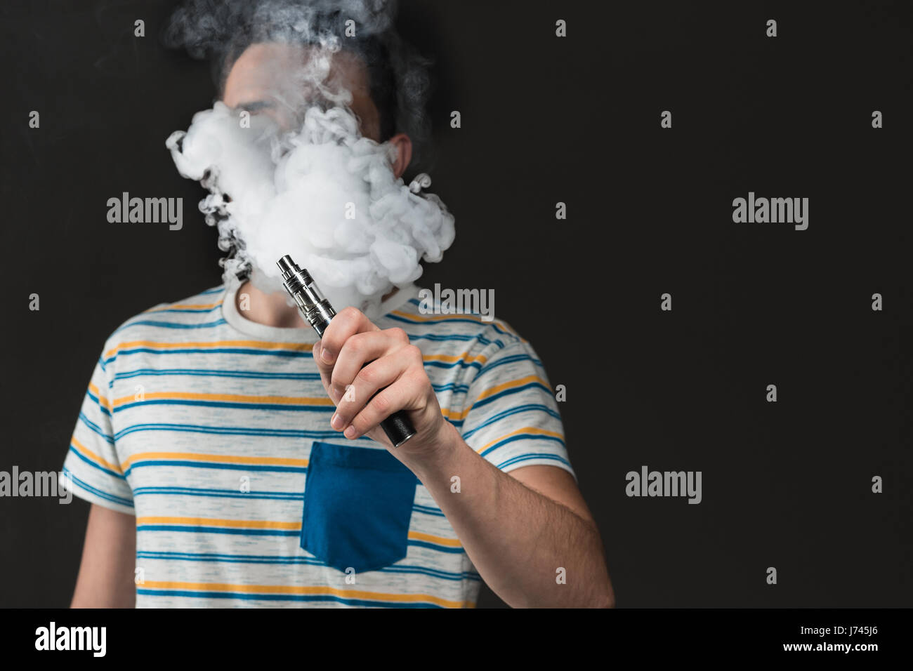 The face of vaping young man Stock Photo - Alamy