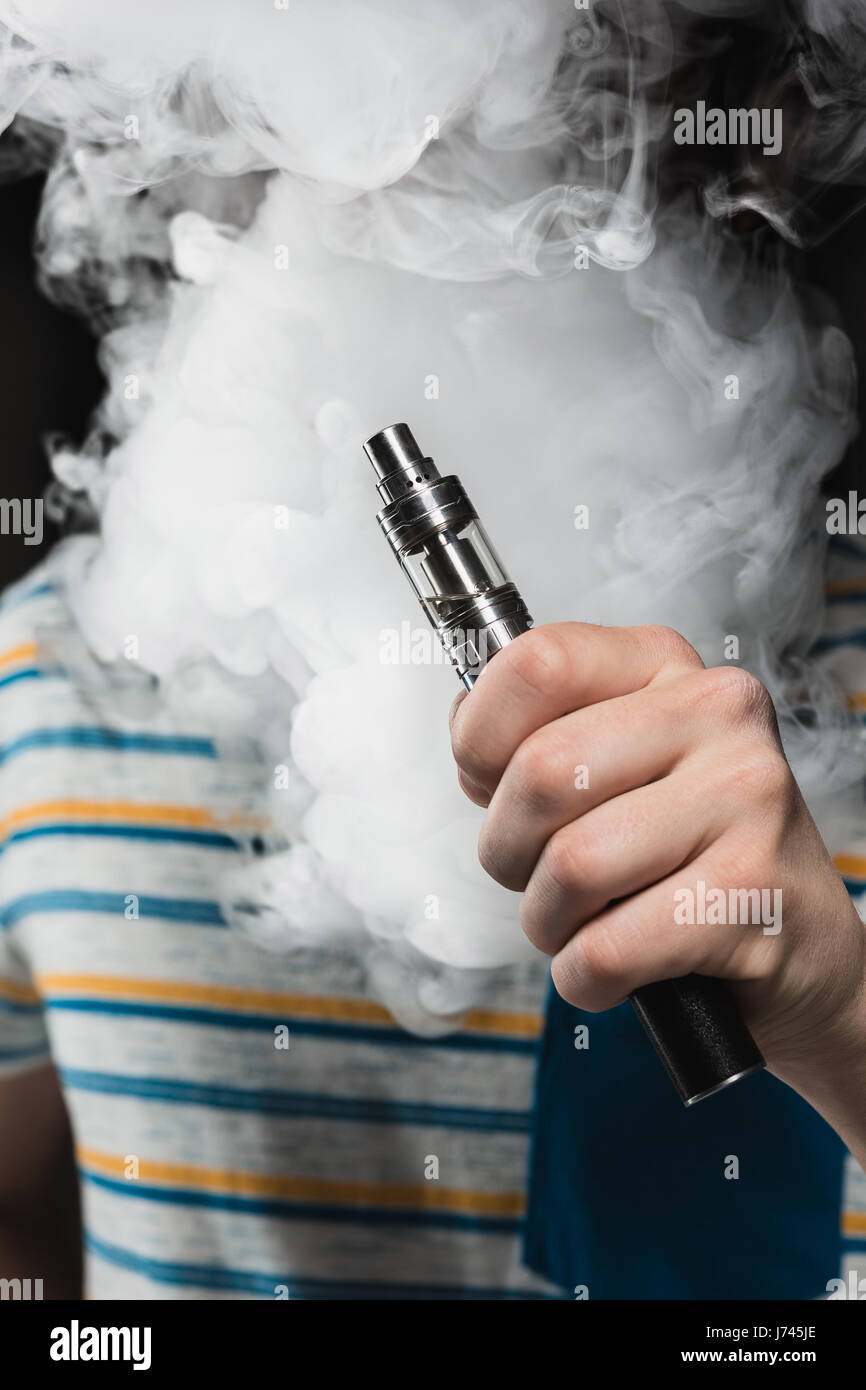 The face of vaping young man Stock Photo - Alamy