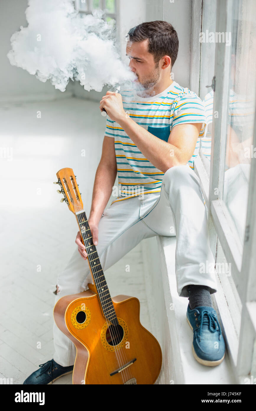 The face of vaping young man Stock Photo - Alamy