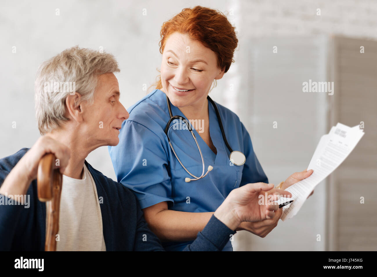 Curious senior gentleman asking for clarification Stock Photo - Alamy