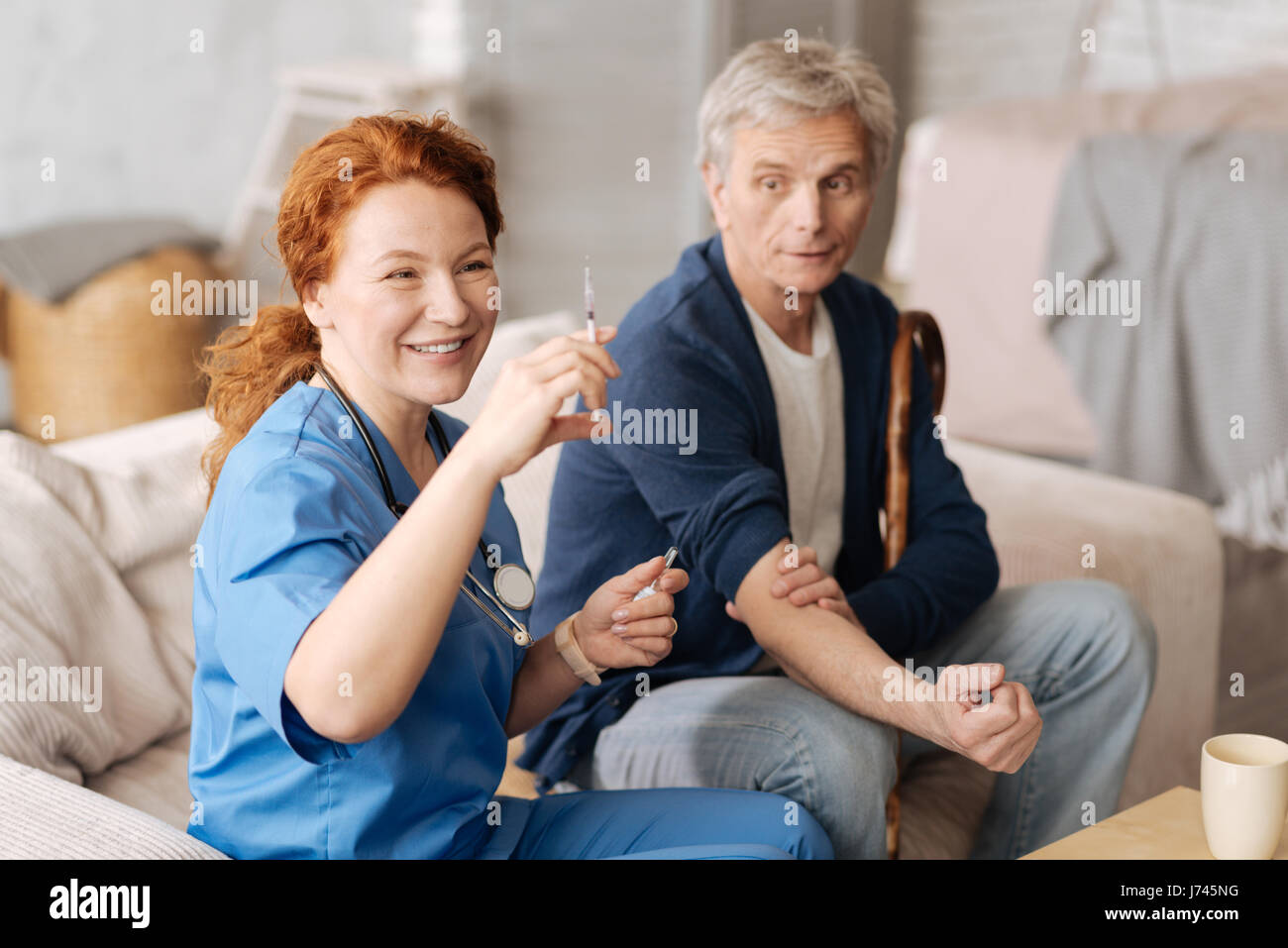 Careful trained doctor preparing an injection Stock Photo - Alamy