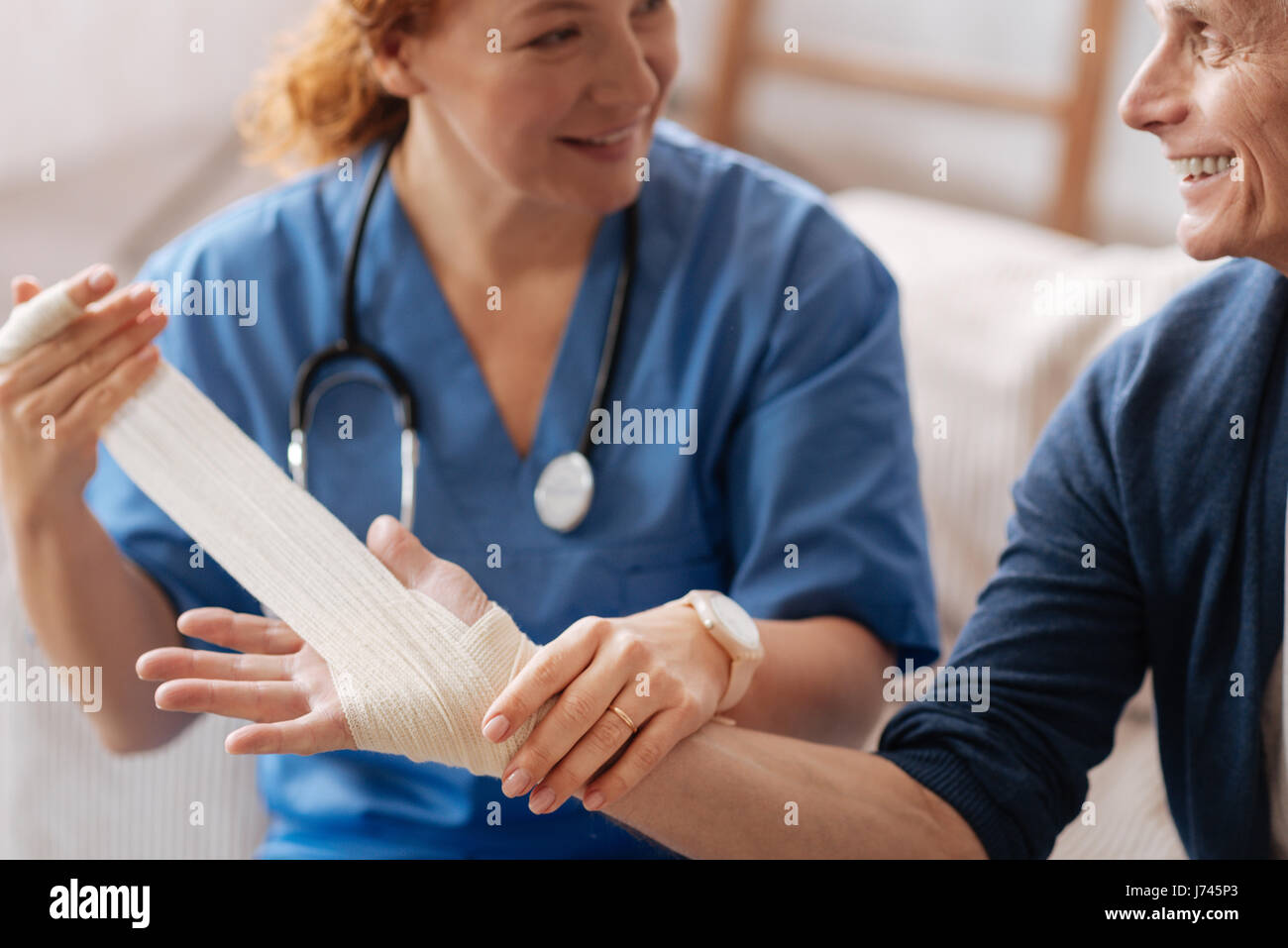 Trained experienced doctor applying medical bandage Stock Photo - Alamy