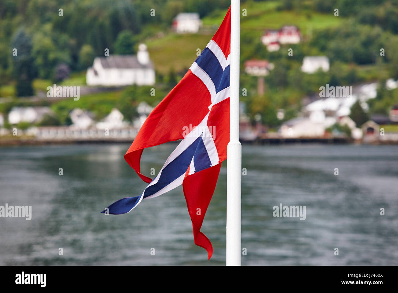 Norwegian flag. Norway fjord landscape with green hill and houses ...