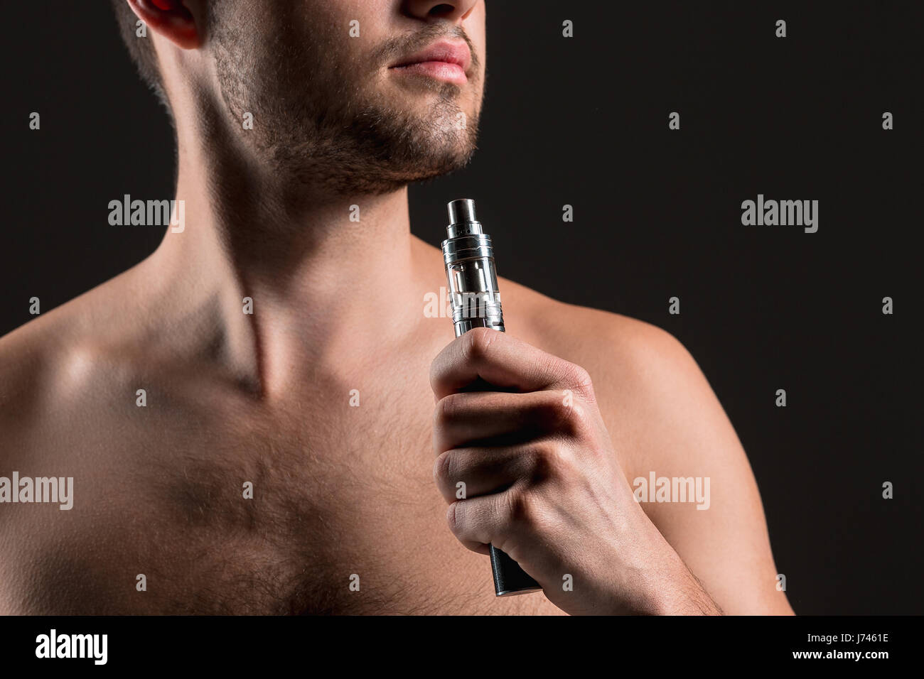 The face of vaping young man Stock Photo - Alamy