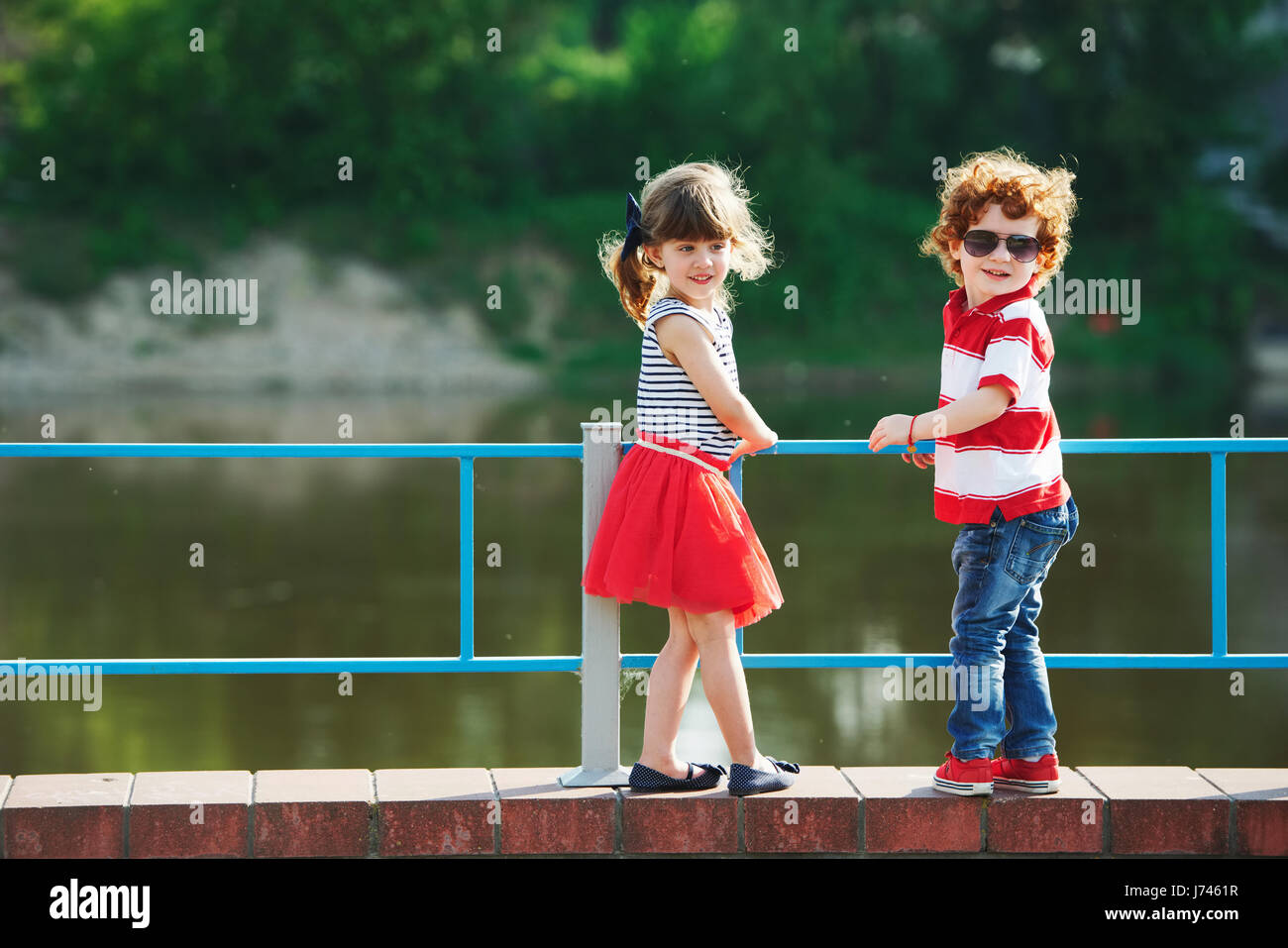 Children hugging friends hi-res stock photography and images - Alamy