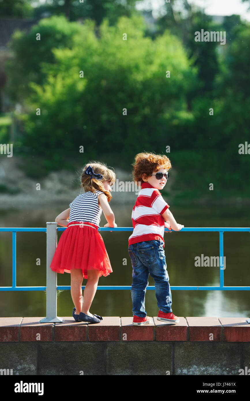 cute little hugging children on the promenade Stock Photo - Alamy