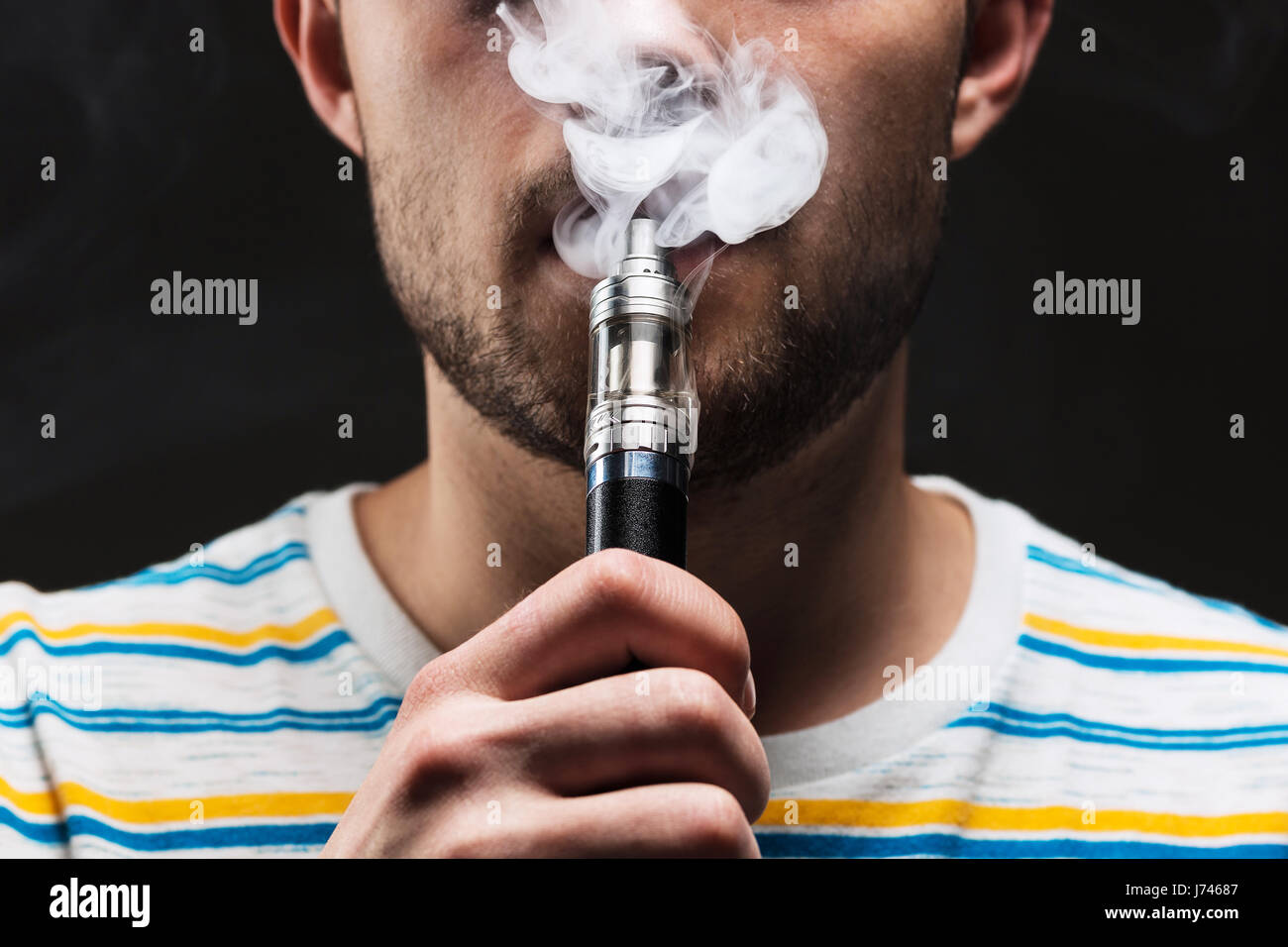 The face of vaping young man Stock Photo - Alamy