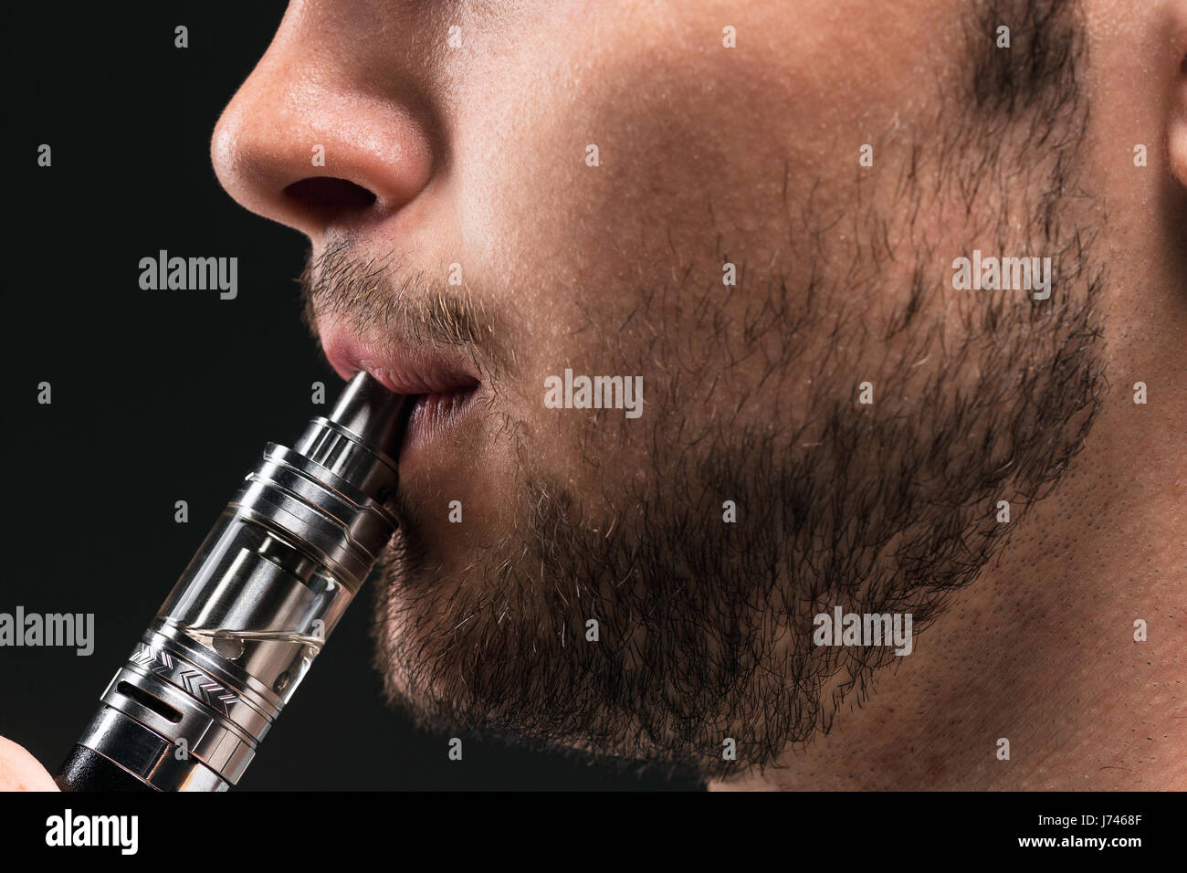 The face of vaping young man Stock Photo - Alamy