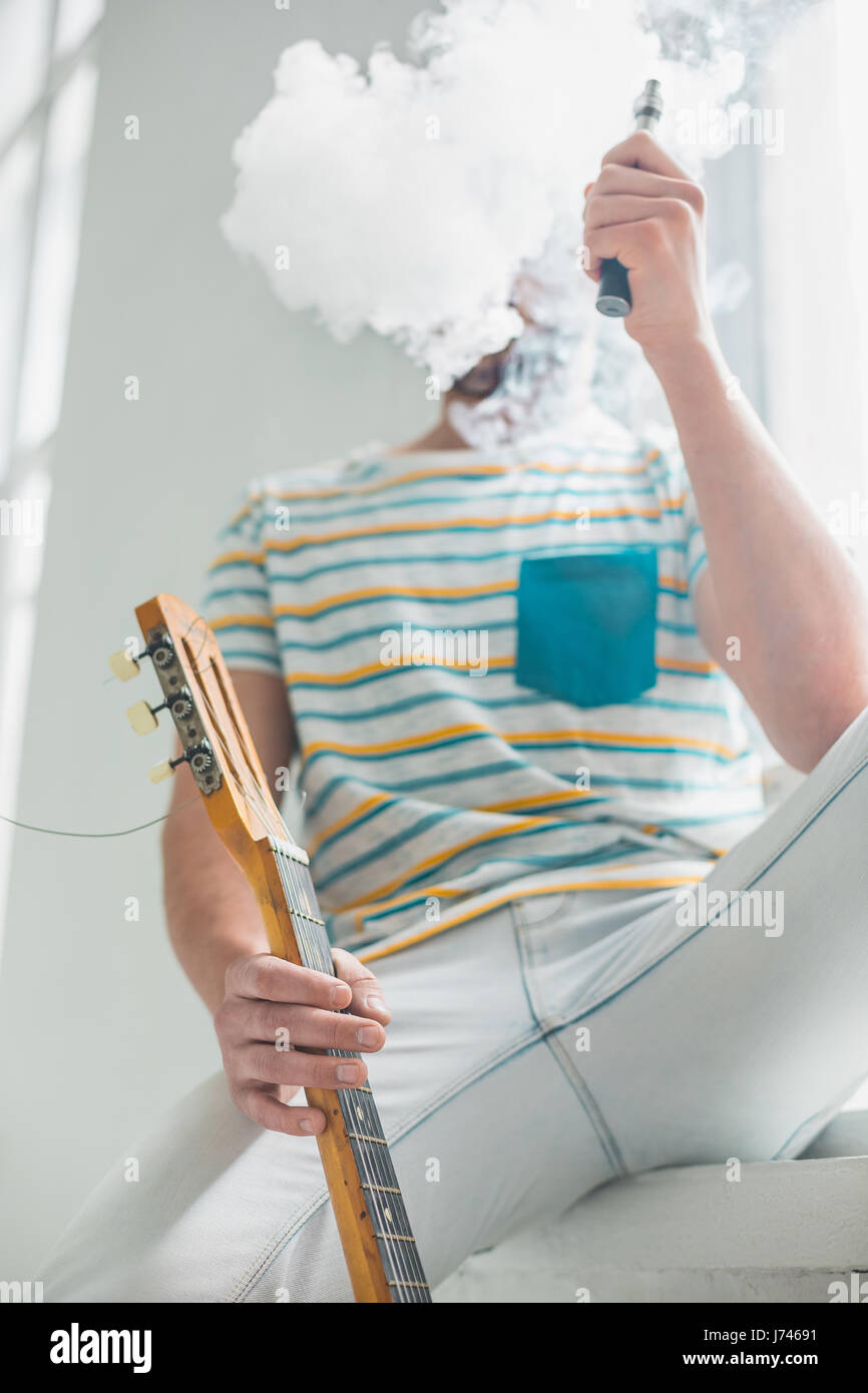 The face of vaping young man Stock Photo - Alamy