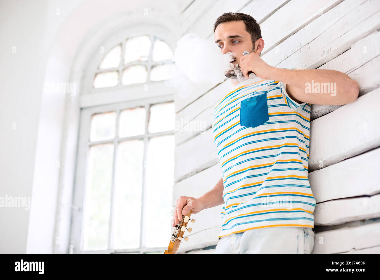 The face of vaping young man Stock Photo - Alamy