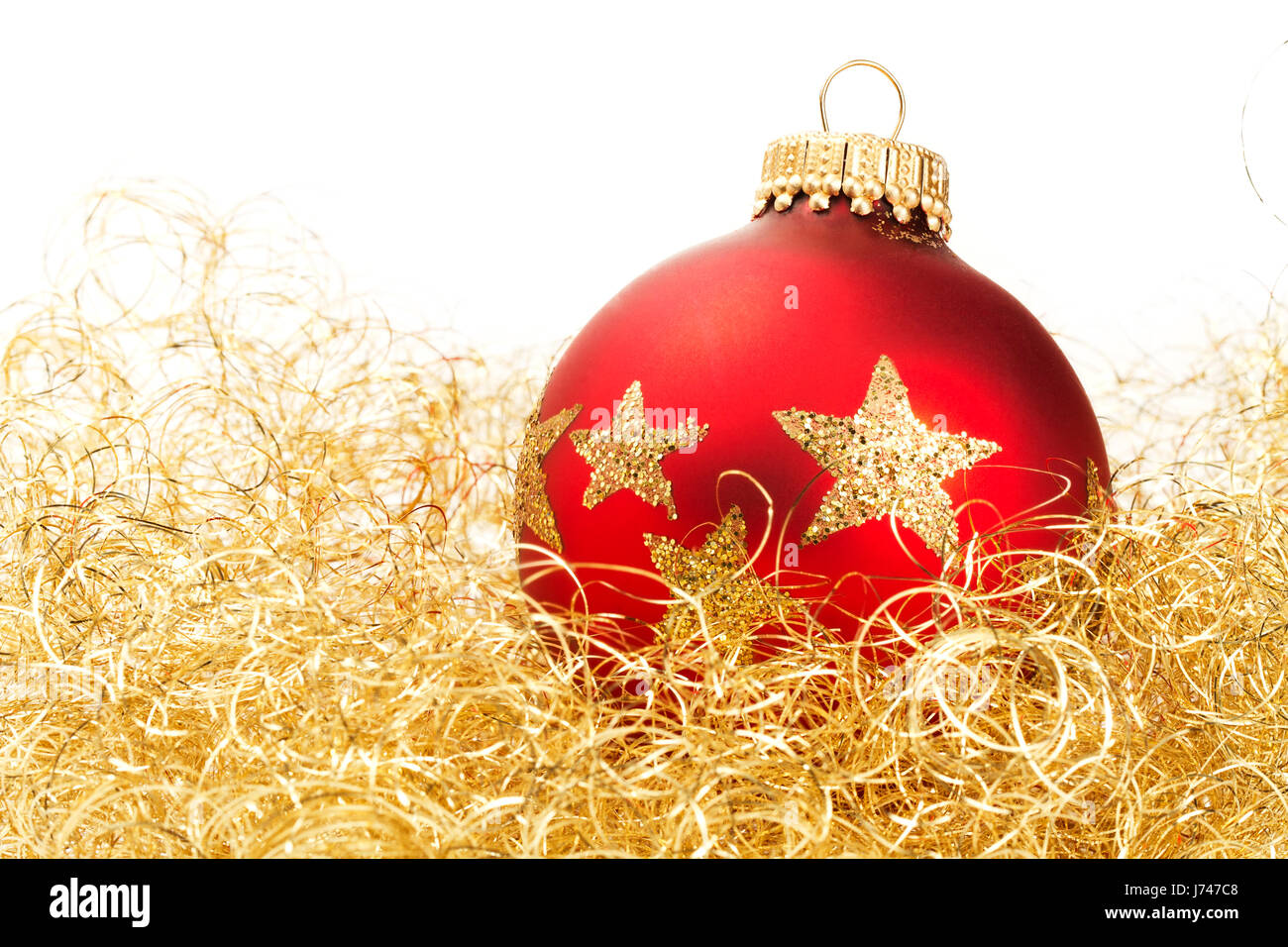 red bauble in golden wadding Stock Photo - Alamy