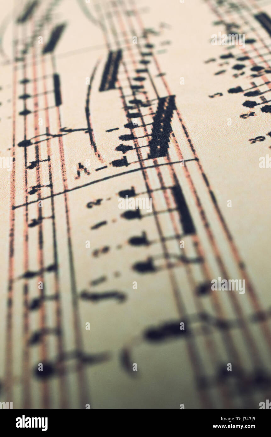 Images of notes on paper in vintage style close-up and blurred ...