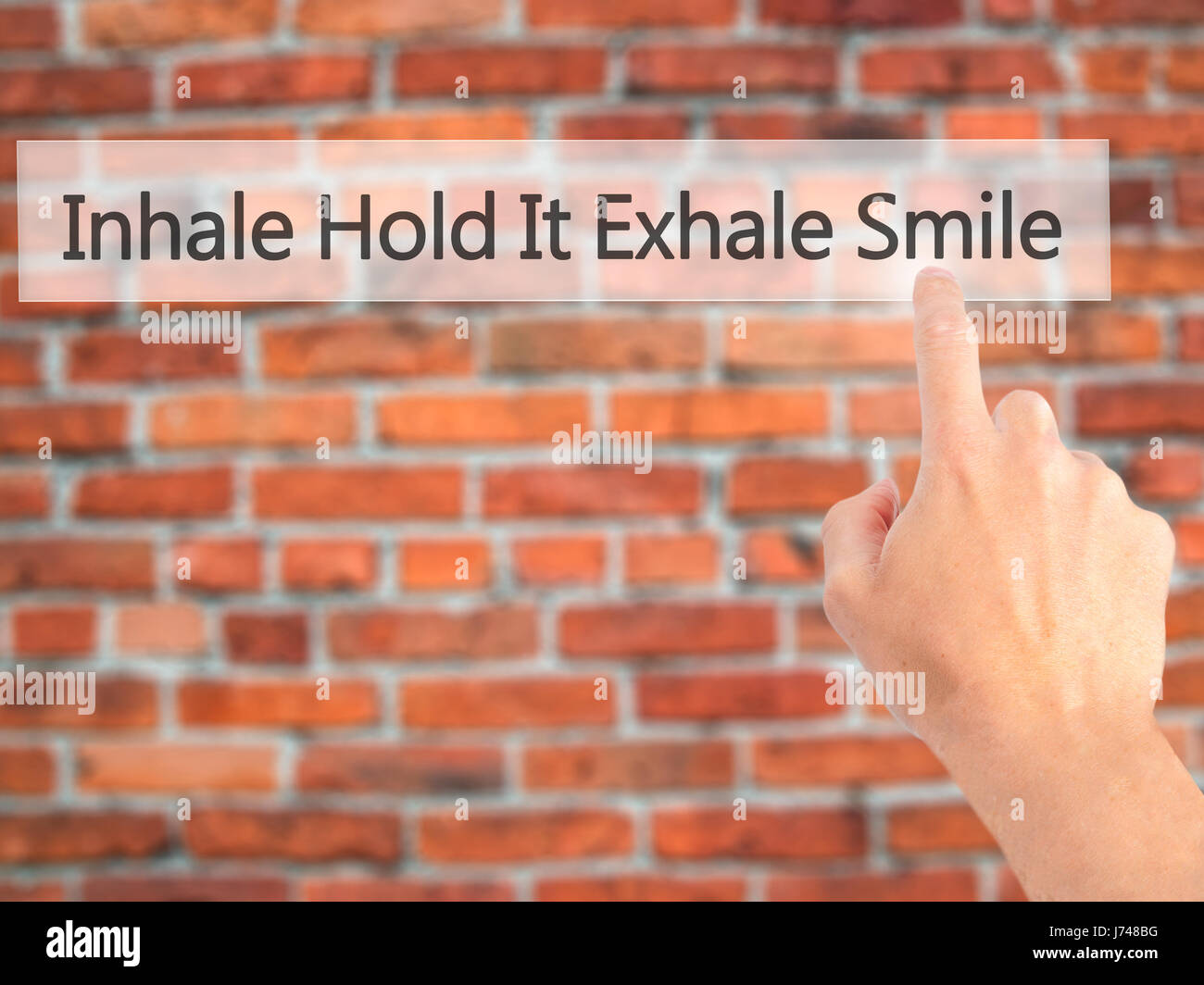 Inhale Hold It Exhale Smile - Hand pressing a button on blurred ...