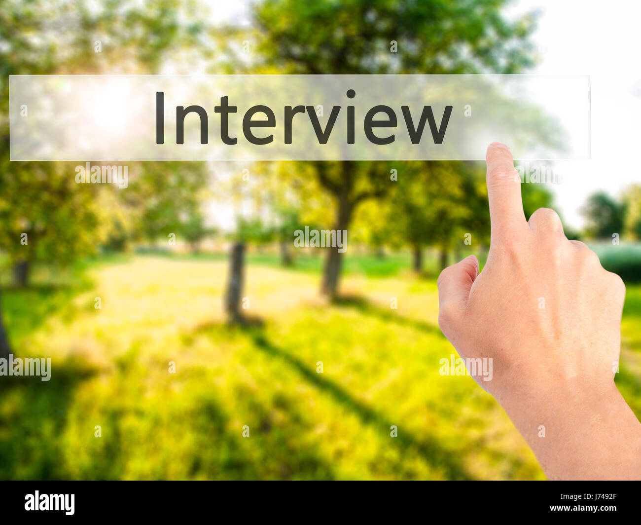 Interview - Hand pressing a button on blurred background concept ...