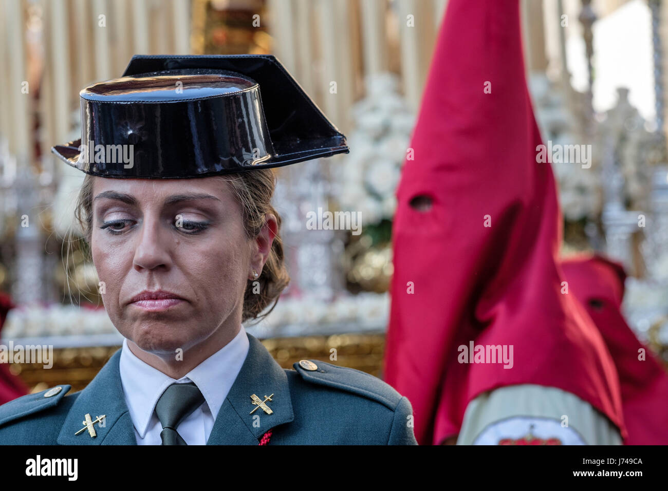 Member of the Guardia Civil police corps in front of the image of Jesus ...