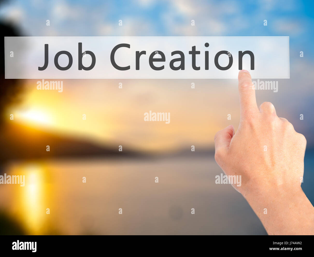 Job Creation - Hand pressing a button on blurred background concept ...