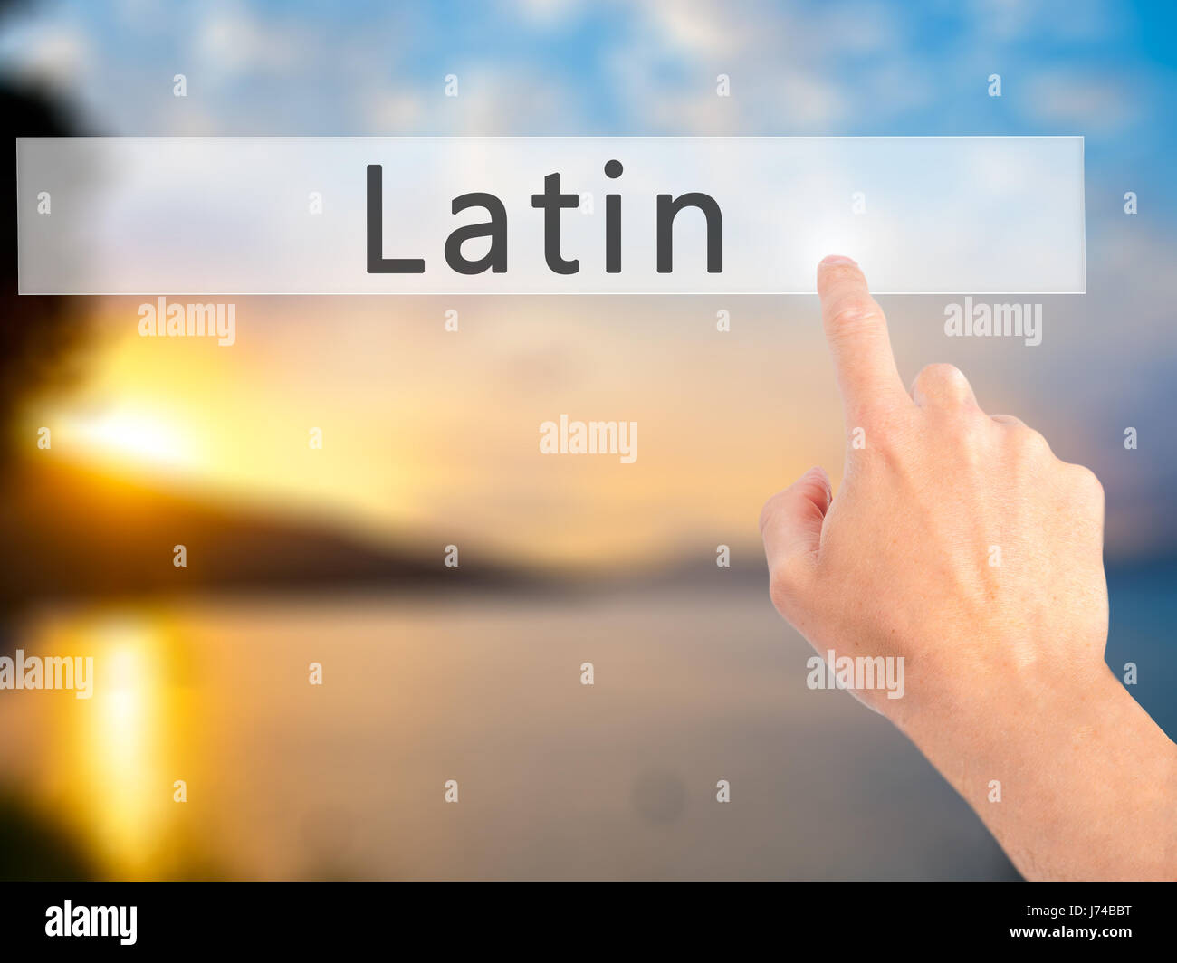 Latin - Hand pressing a button on blurred background concept . Business ...
