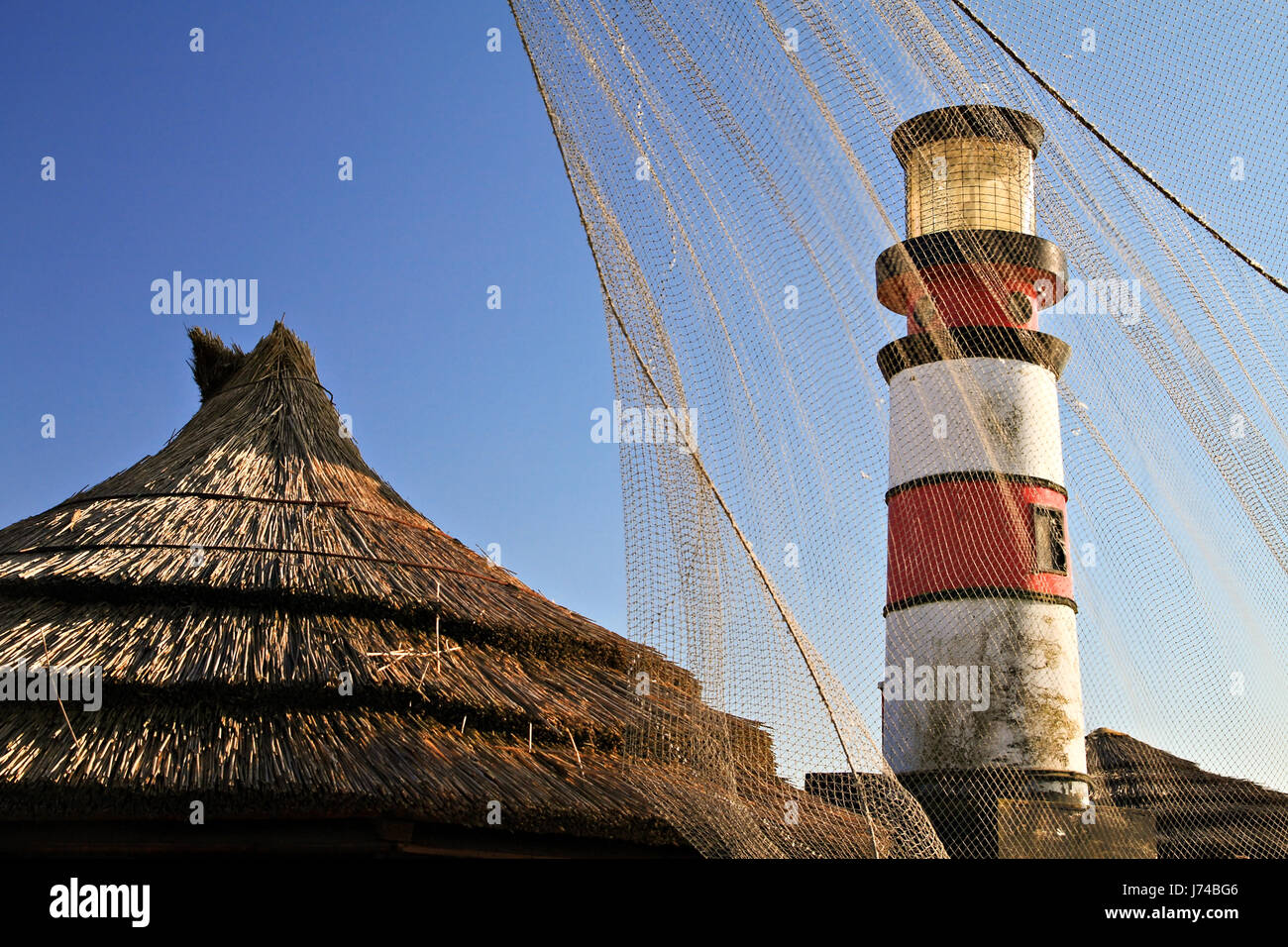 net thatched roof fishing net lighthouse rooftop blue holiday vacation ...