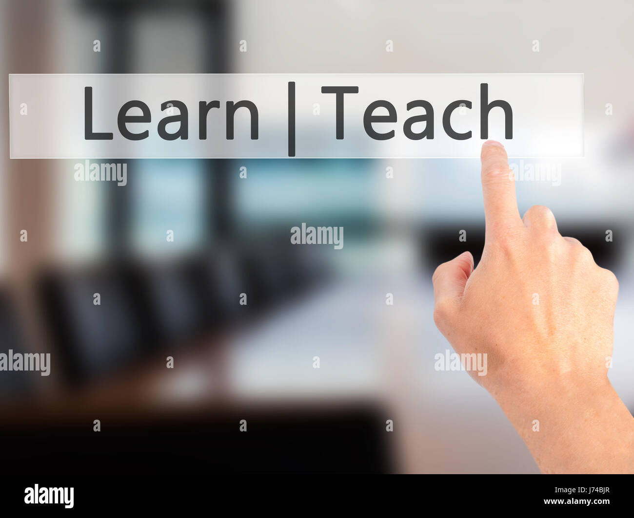 Learn Teach - Hand pressing a button on blurred background concept ...