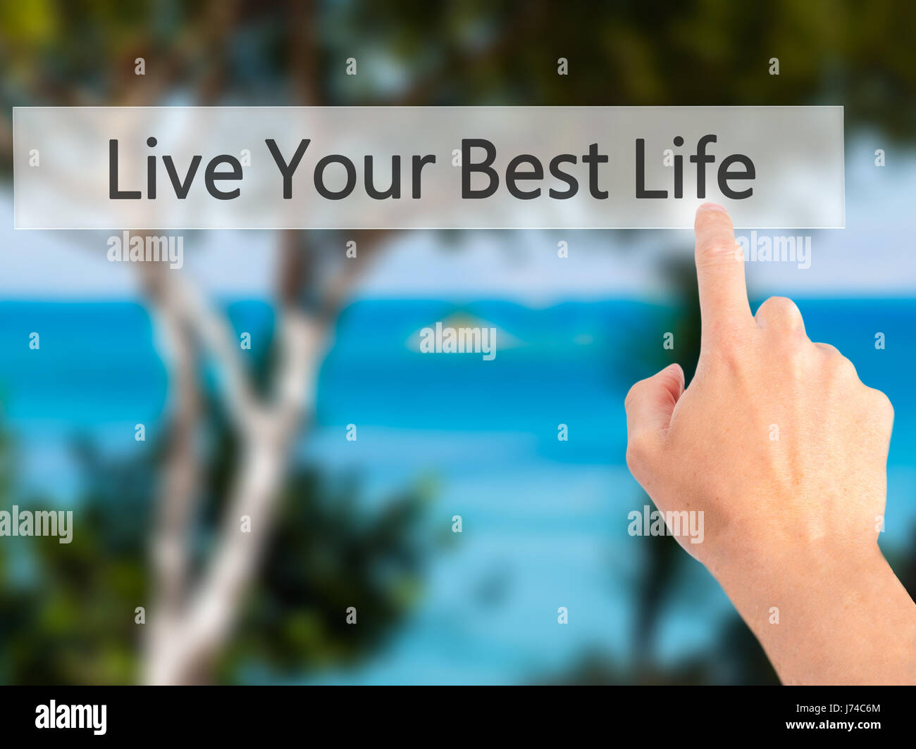 Live Your Best Life - Hand pressing a button on blurred background ...