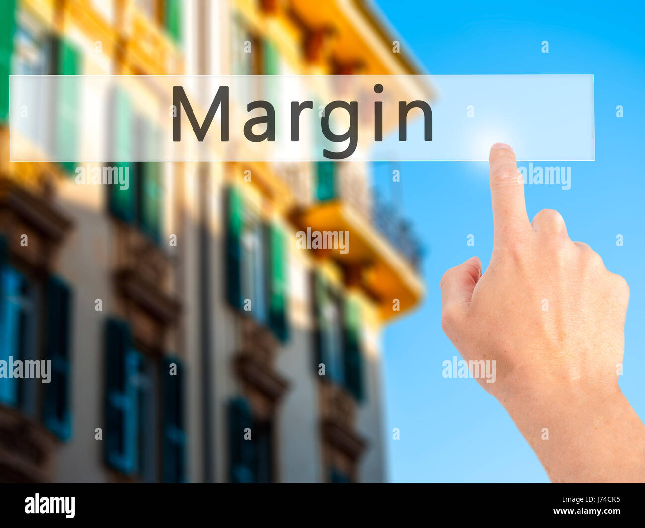 Margin - Hand pressing a button on blurred background concept ...