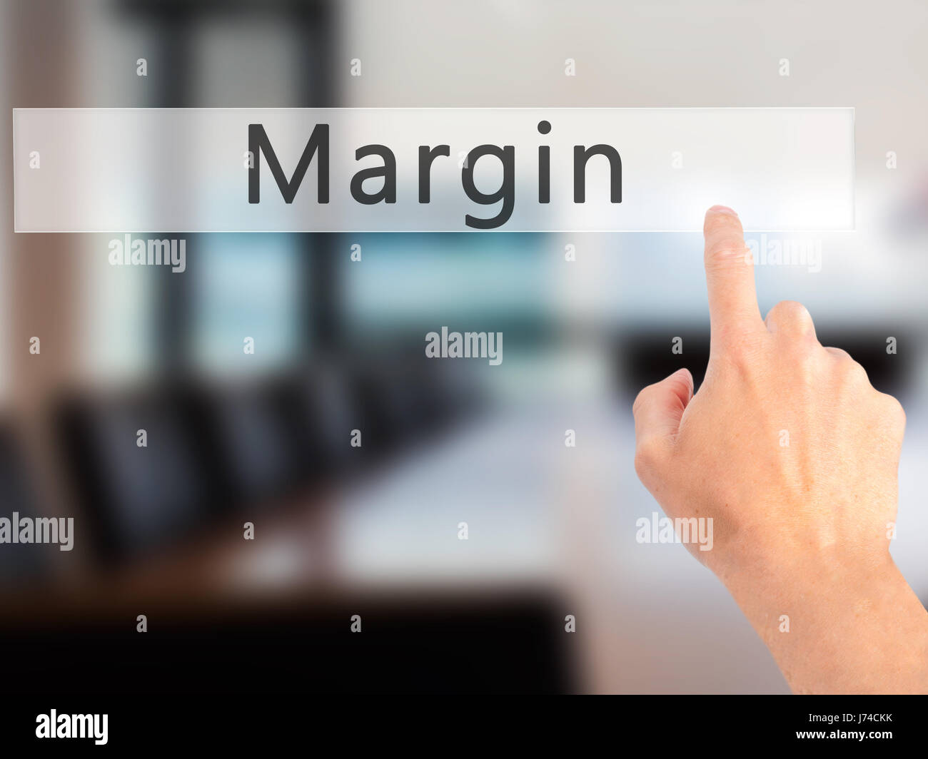Margin - Hand pressing a button on blurred background concept ...