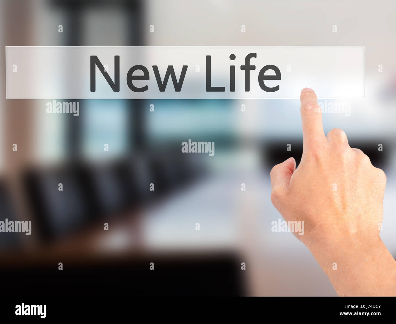 New Life - Hand pressing a button on blurred background concept ...