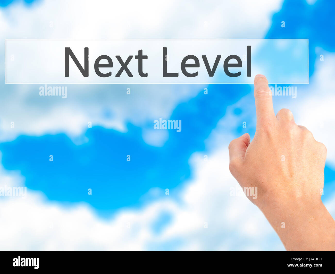 Next Level - Hand pressing a button on blurred background concept ...