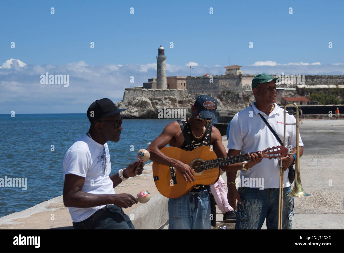 Cuban musicians playing at Malecon, Havana, Cuba Stock Photo - Alamy
