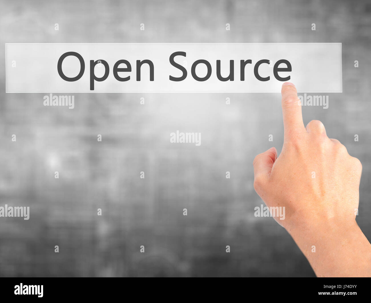 Open Source - Hand pressing a button on blurred background concept . Business, technology ...
