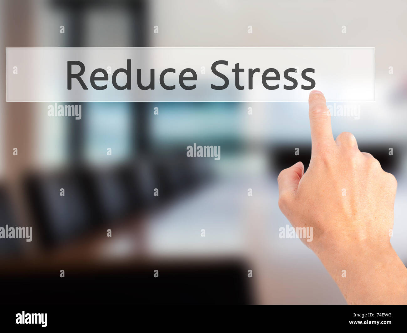 Reduce Stress - Hand pressing a button on blurred background concept ...