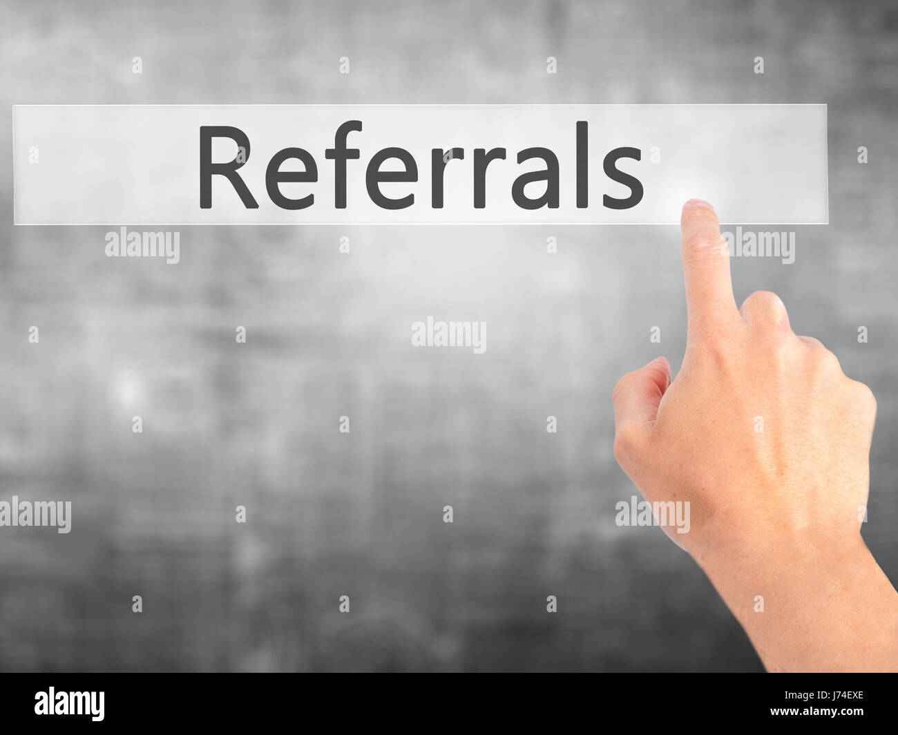 Referrals - Hand pressing a button on blurred background concept ...