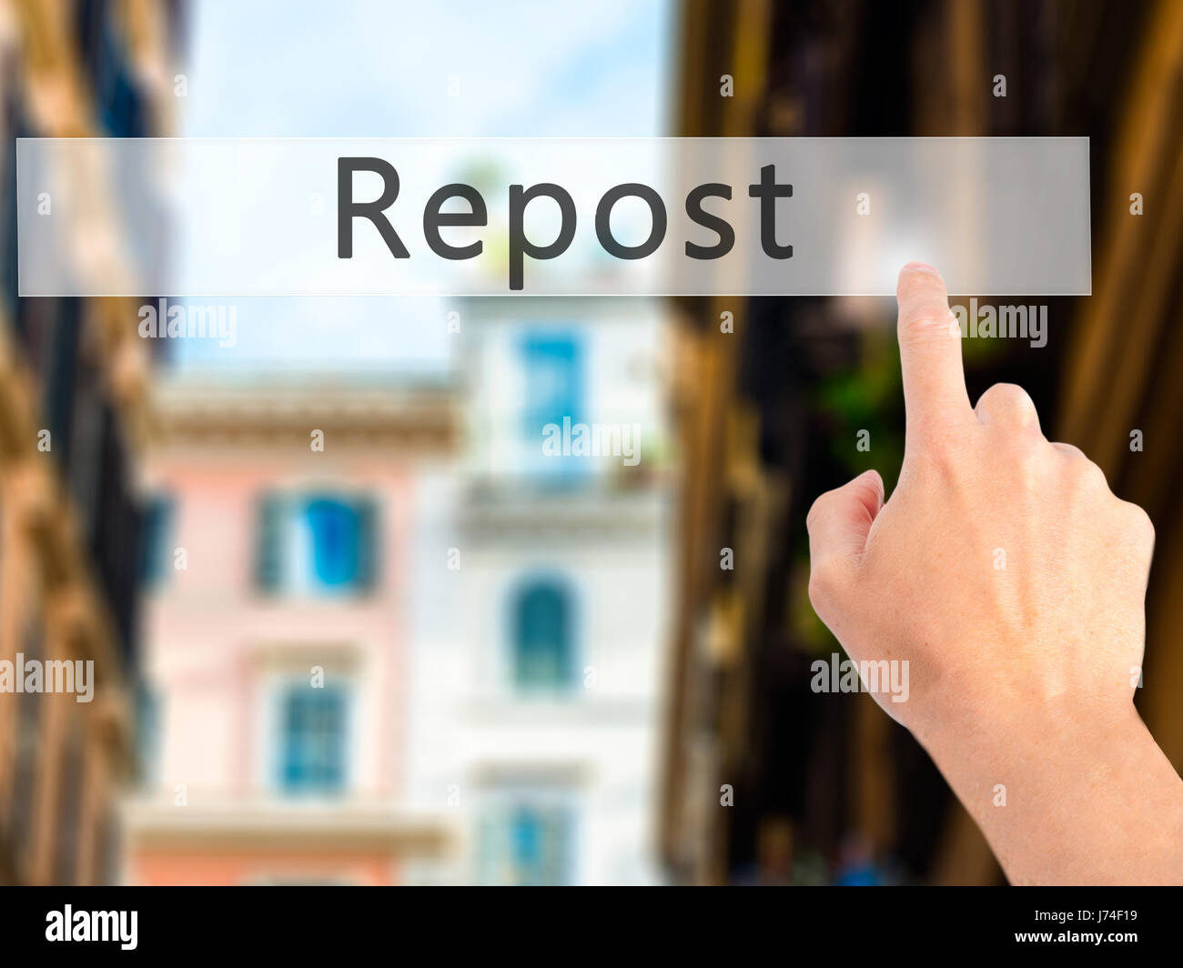 Repost - Hand pressing a button on blurred background concept ...