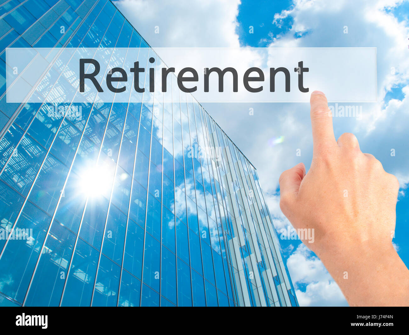 Retirement - Hand pressing a button on blurred background concept ...