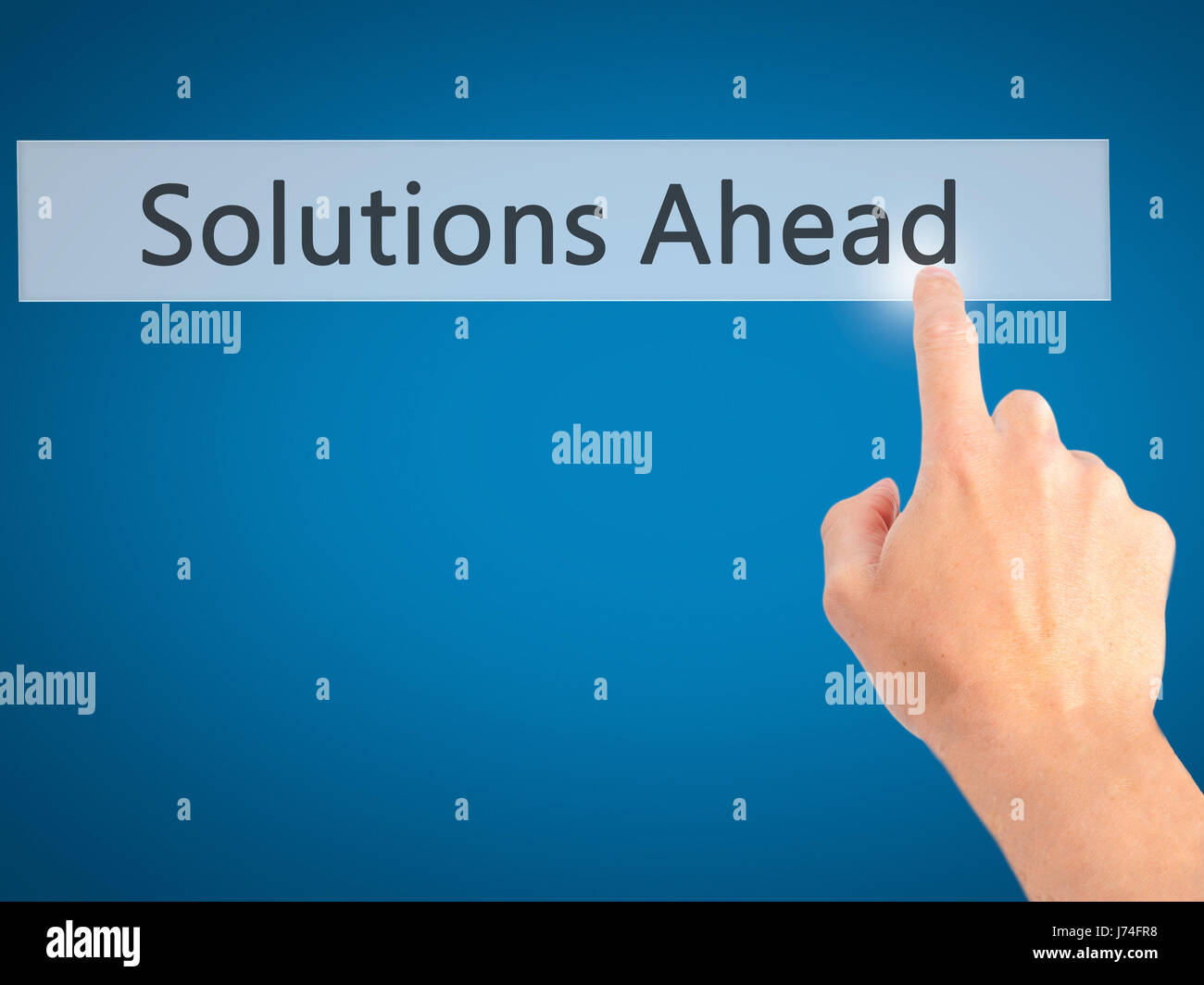 Solutions Ahead - Hand pressing a button on blurred background concept ...
