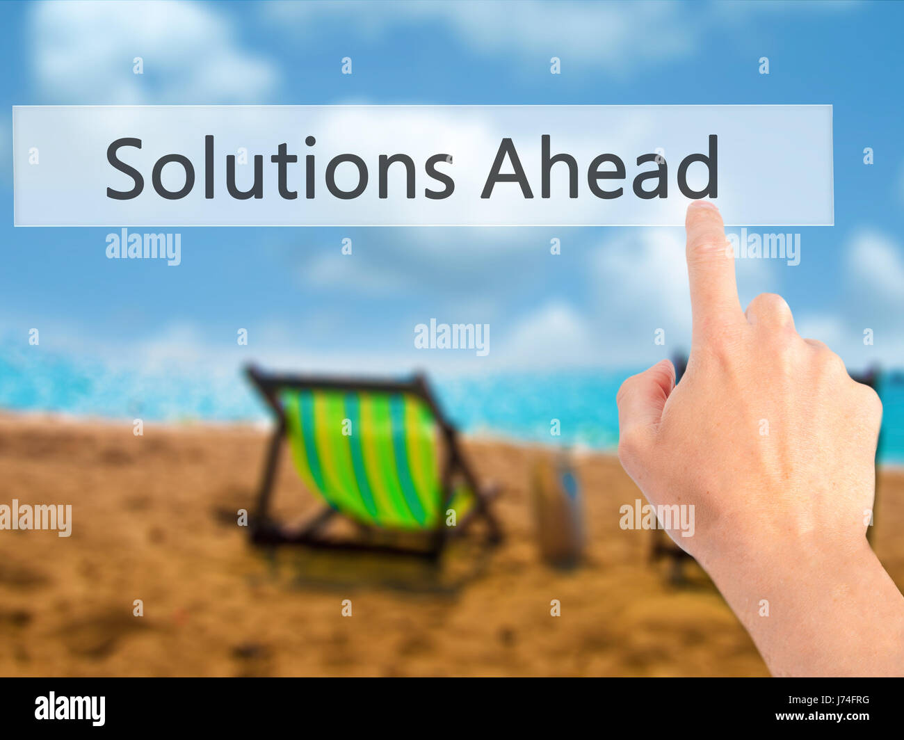 Solutions Ahead - Hand pressing a button on blurred background concept ...