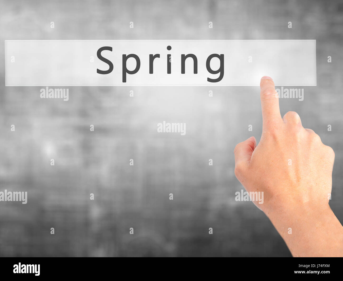 Spring - Hand pressing a button on blurred background concept ...
