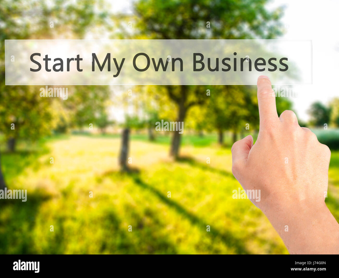 Start My Own Business - Hand pressing a button on blurred background ...