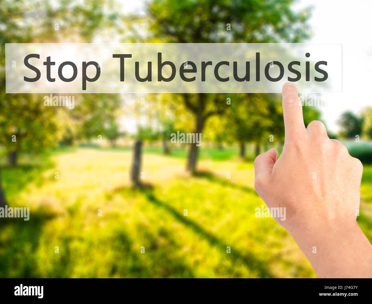 Stop Tuberculosis - Hand pressing a button on blurred background ...