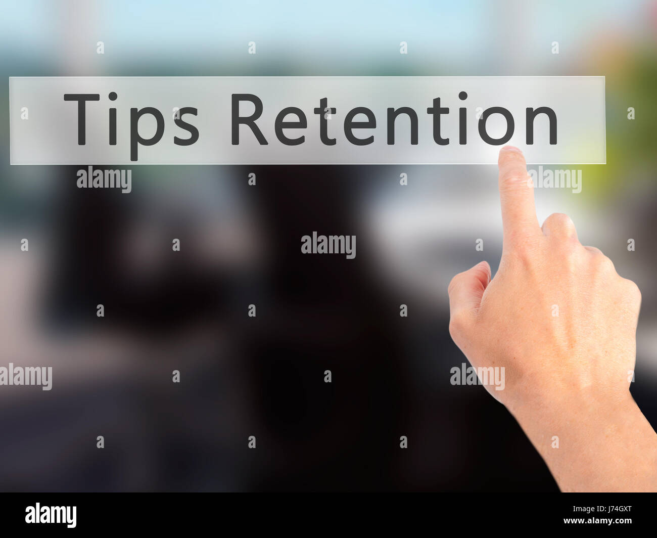 Tips Retention - Hand pressing a button on blurred background concept ...